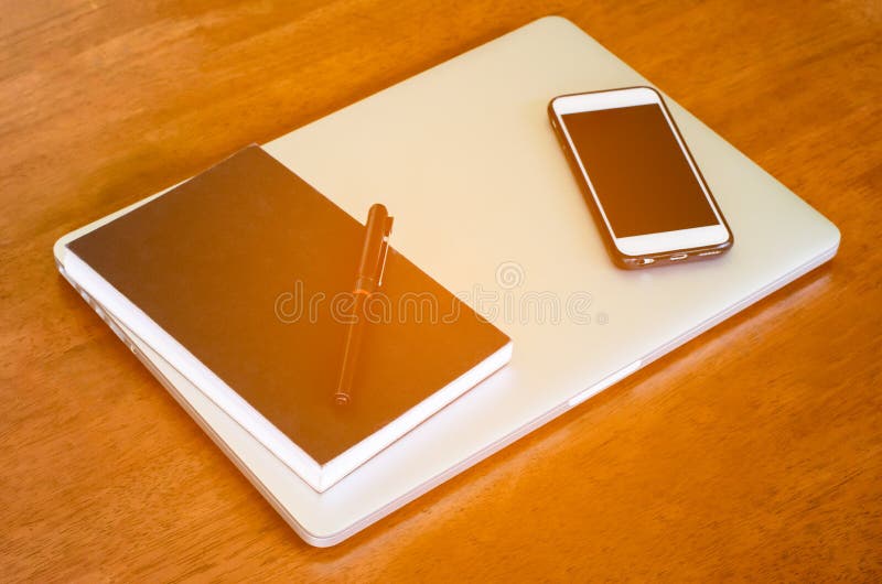 Old Note Book with Pen with Mobile Phone and Tablet Pc on Wooden Desk ...