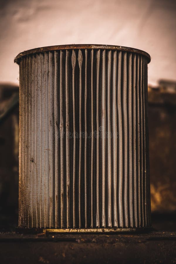 Old Oil Filter on a Shelf, Vertical Stock Photo - Image of fuel ...