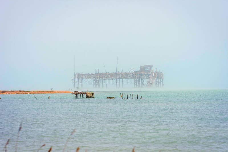 Old oil rig in Caspian Sea stock photo. Image of plant - 112143052