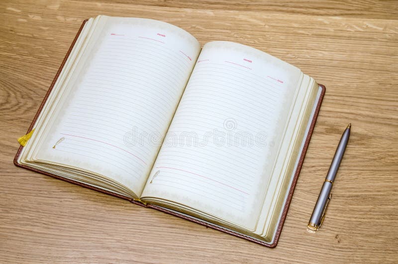 Old Open Book with Fountain Pen on Wooden Table Stock Image - Image of ...