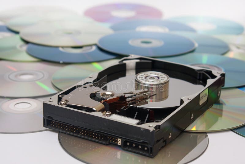 Old Opened Hard Disc on a Pile of Compact Discs Stock Photo - Image of ...