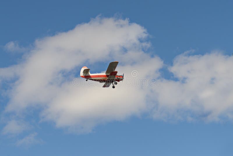 Old orange biplane flying stock photo. Image of cloud - 118027030