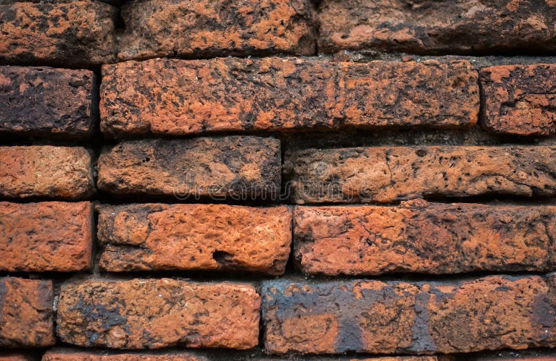 Old orange brick wall stock photo. Image of overlaid - 306219430