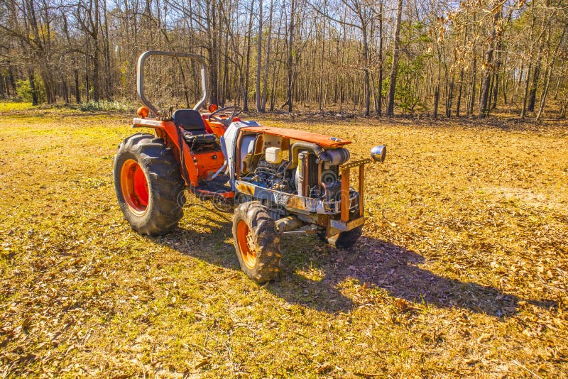 Old orange farm tractor editorial image. Image of field - 198629425