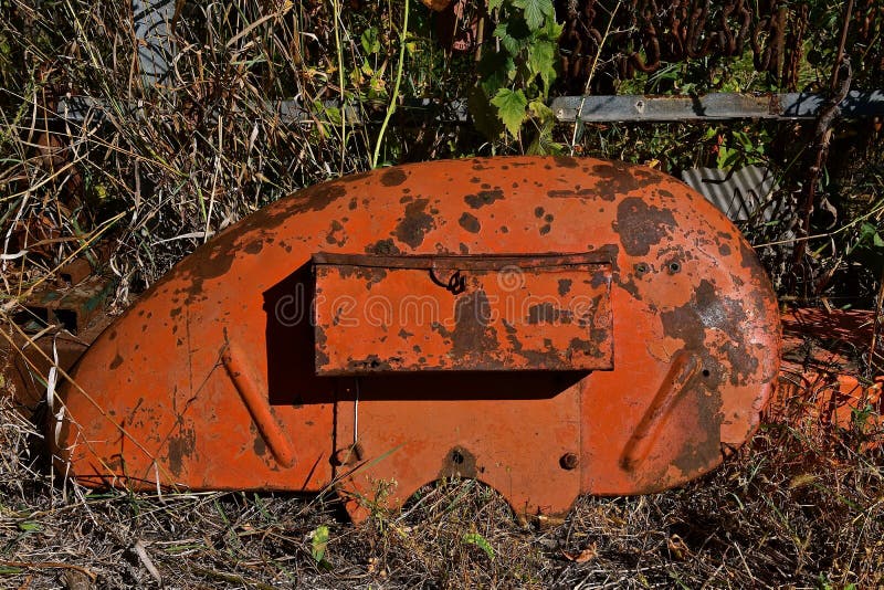 Old orange tractor fender stock image. Image of chalmers - 100164177