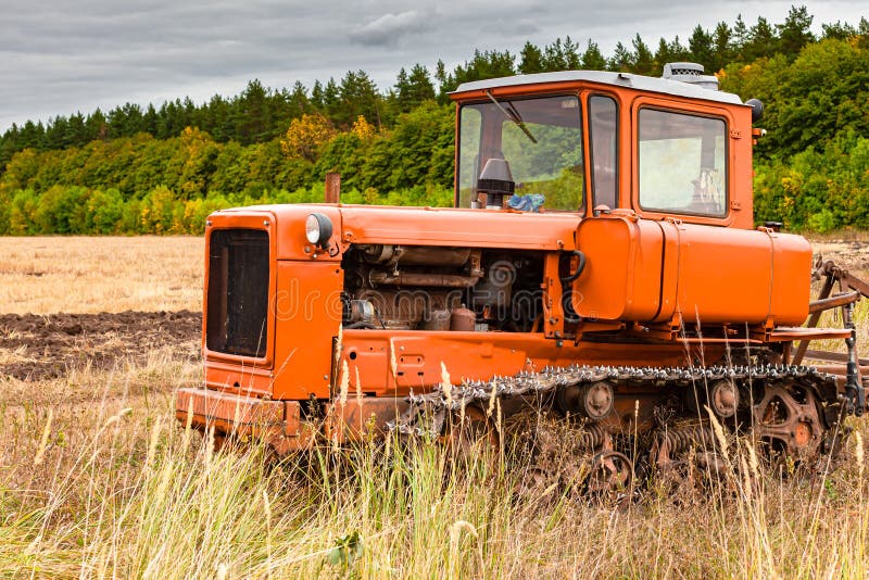 Old Orange Tractor Stands in the Field Stock Image - Image of transport ...