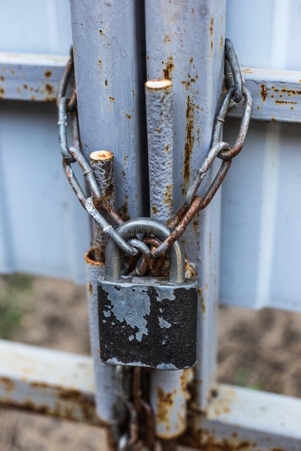 Old Padlock and Chain on the Gate Stock Image - Image of restricted ...