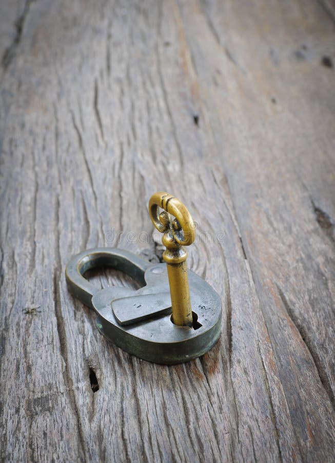 Old Padlock and Key on a Wooden Table. Stock Image - Image of metallic ...