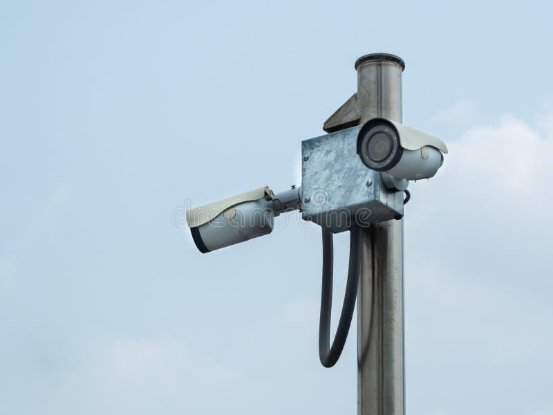 Old Pair of Surveillance Camera or CCTV Installed on Poles Stock Photo ...