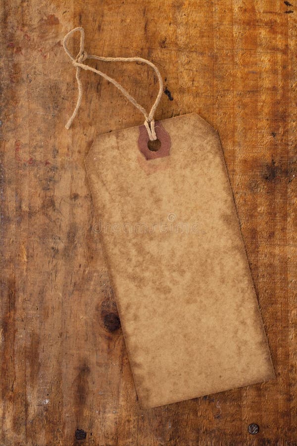 Old Paper Tag with String on Grunge Wooden Table Stock Photo - Image of ...