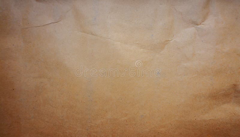 A Brown Sheet of Paper with a Hole Ripped and Torn through the Centre ...