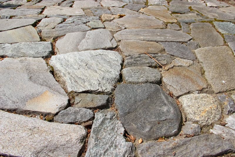 An Old Pavement Cobbled with Natural Rocks Stock Photo - Image of cover ...