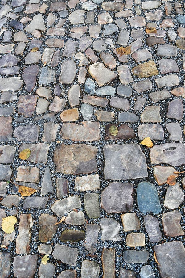 Old Pavement of Stones of Different Colors and Sizes Stock Image ...