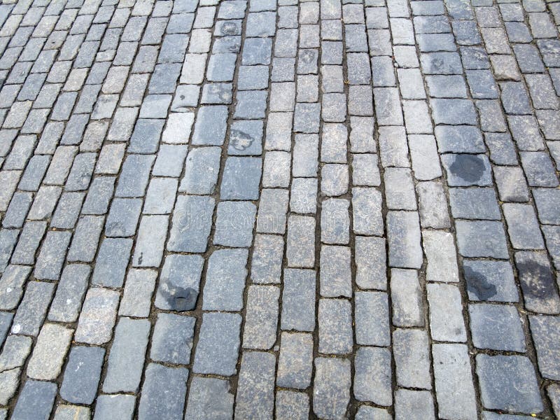 Old Paving Stones Made of Natural Stone on Red Square Stock Image ...