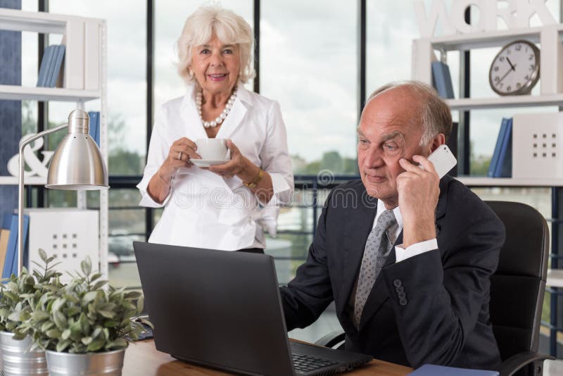 Old people in the office stock photo. Image of couple - 62618764