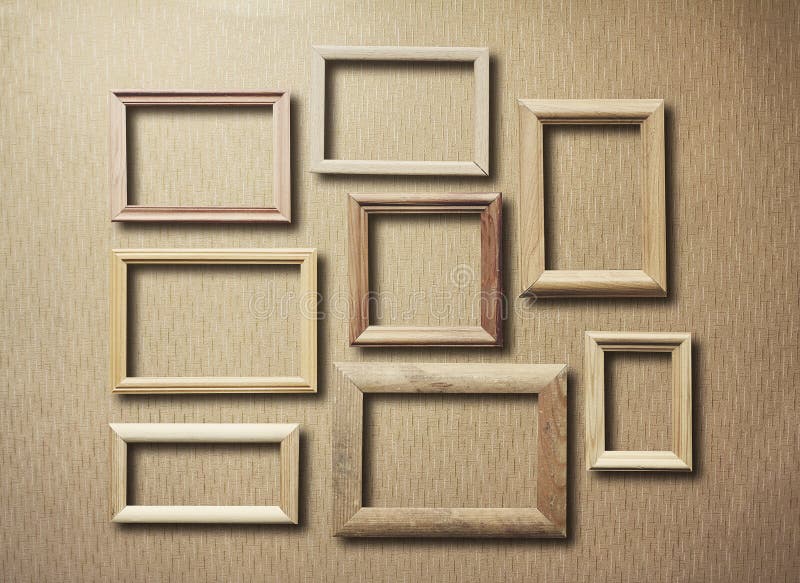 Old frames on wooden wall stock photo. Image of texture - 211426558