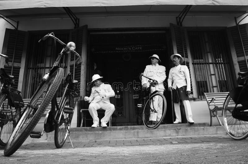Three People Stand on Front of Old House, Ready for Riding Cycle ...