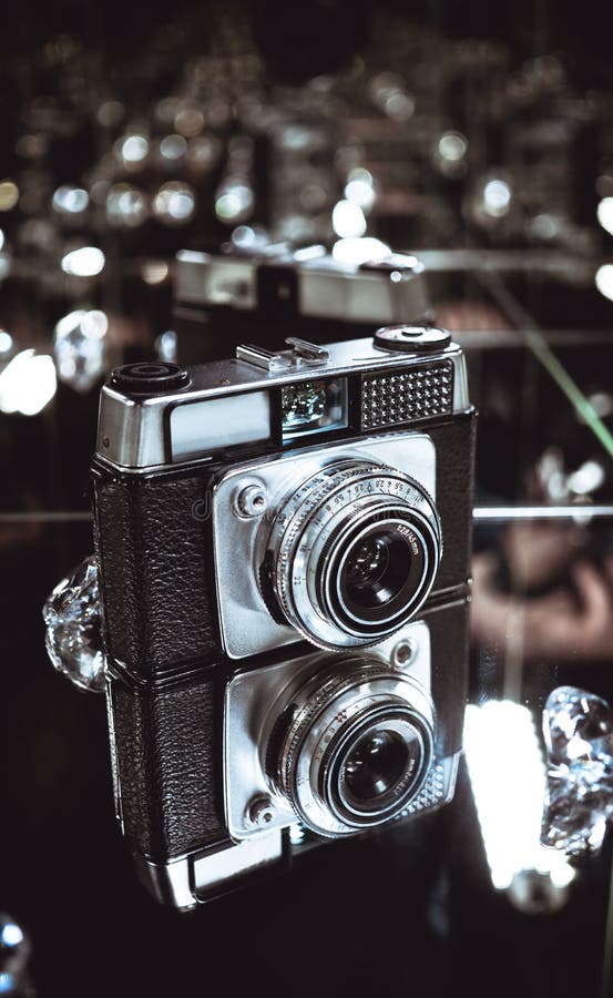 Old Photography Camera in the Mirror Cube Reflection Editorial Stock ...