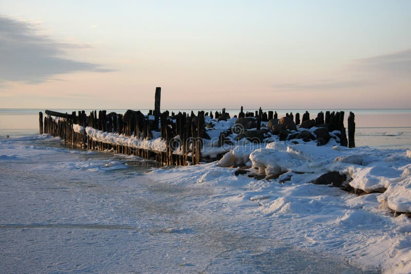 Old pier in winter sea stock photo. Image of water, seaside - 29496612