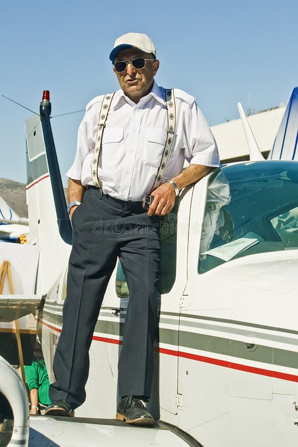 An Old Pilot on the Plane Wing Stock Photo - Image of person, head ...