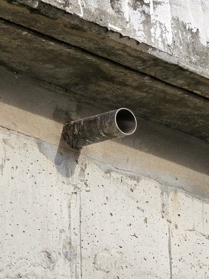 Old Pipe on the Cement Wall of the Cement Bridge Stock Photo - Image of ...