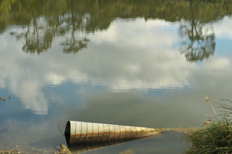 Old pipe in pond stock photo. Image of alone, bore, reflection - 43687010