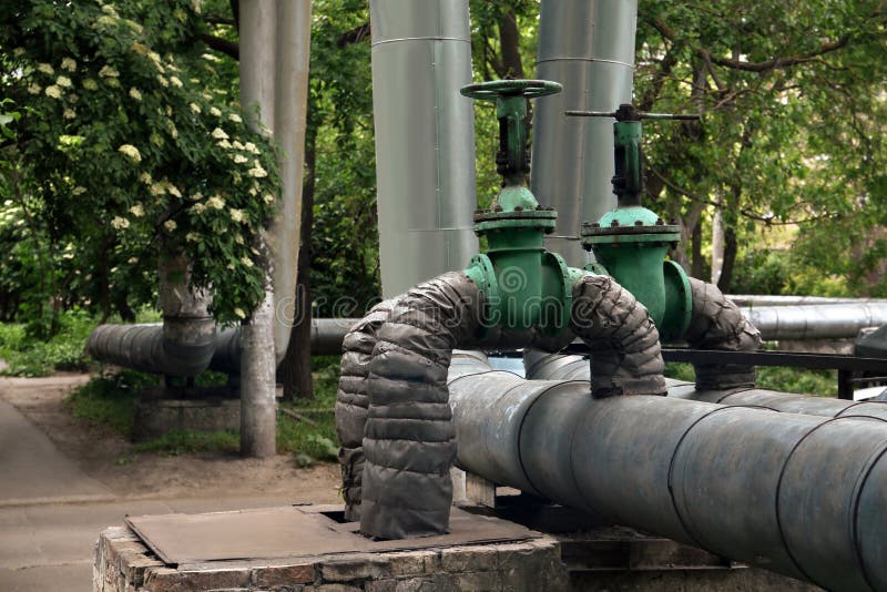 Old Pipes with Valve Gate on City Street Stock Photo - Image of park ...