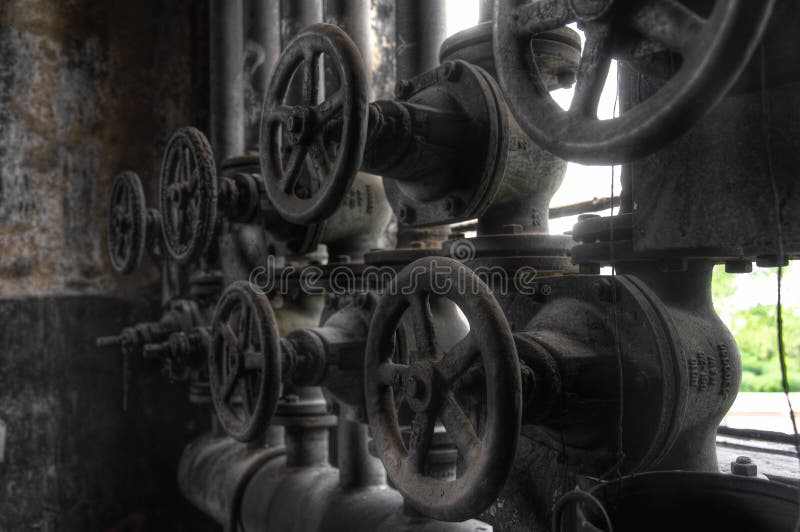 Old pipes with valves stock image. Image of industry - 37570767