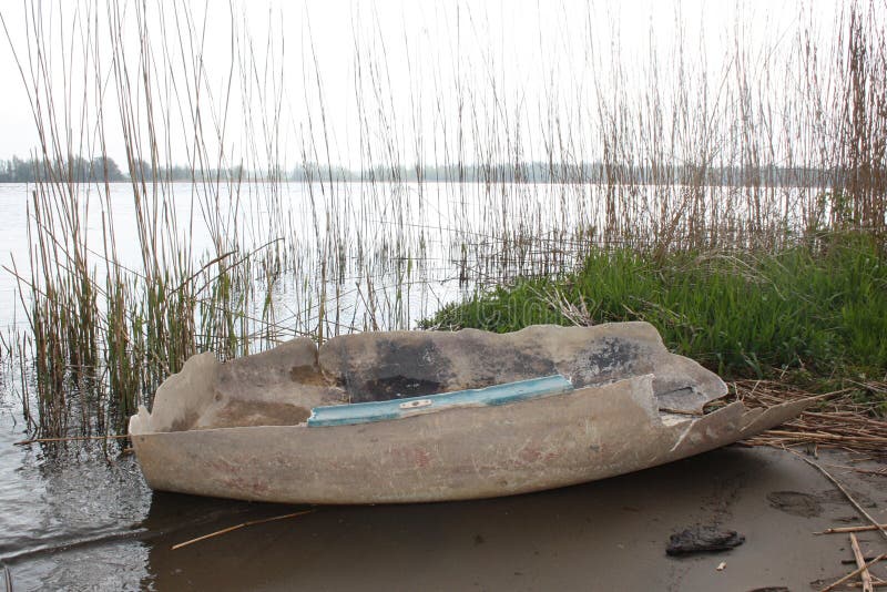 An Old Plastic Boat that Has Never Been Removed from the Beach Stock ...