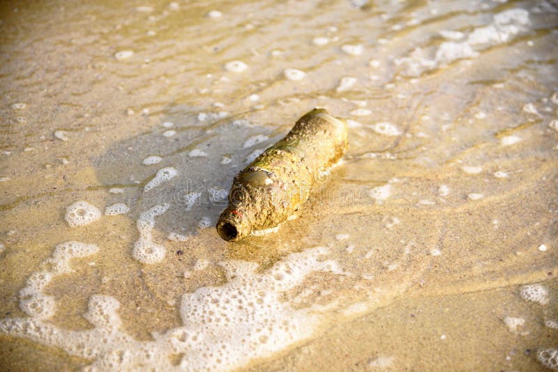 An Old Plastic Bottle Covered with Shells Stock Photo - Image of ...