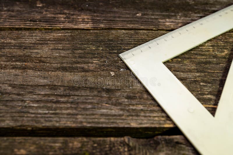 Old, Plastic Triangle Ruler on Aged Weathered Pine Wood Boards Stock ...