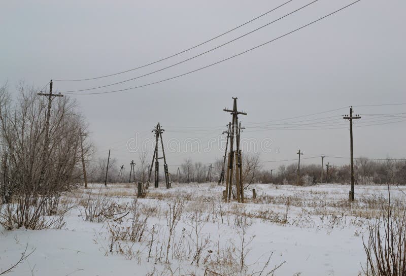 Old Power Lines in a Winter Field in the Russian Outback Stock Photo ...