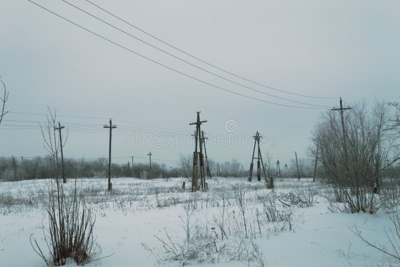 Old Power Lines in a Winter Field in the Russian Outback Stock Photo ...