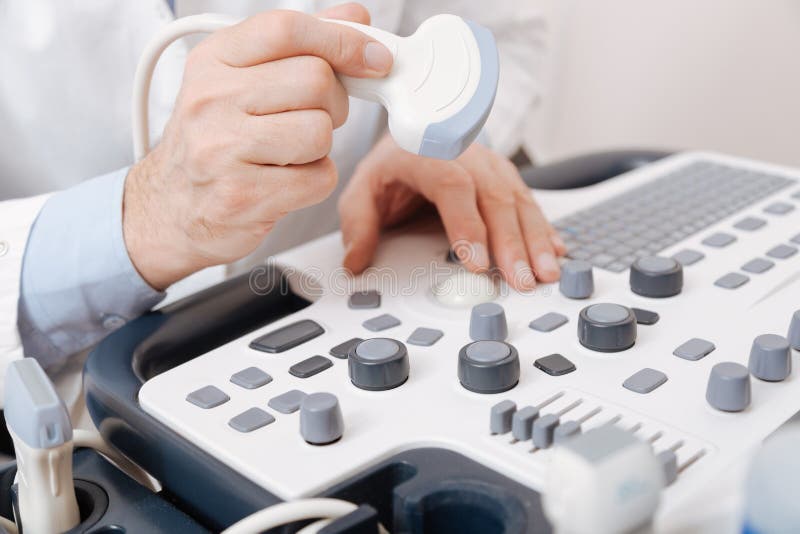Old Practitioner Using Sonogram Equipment in the Clinic Stock Photo ...