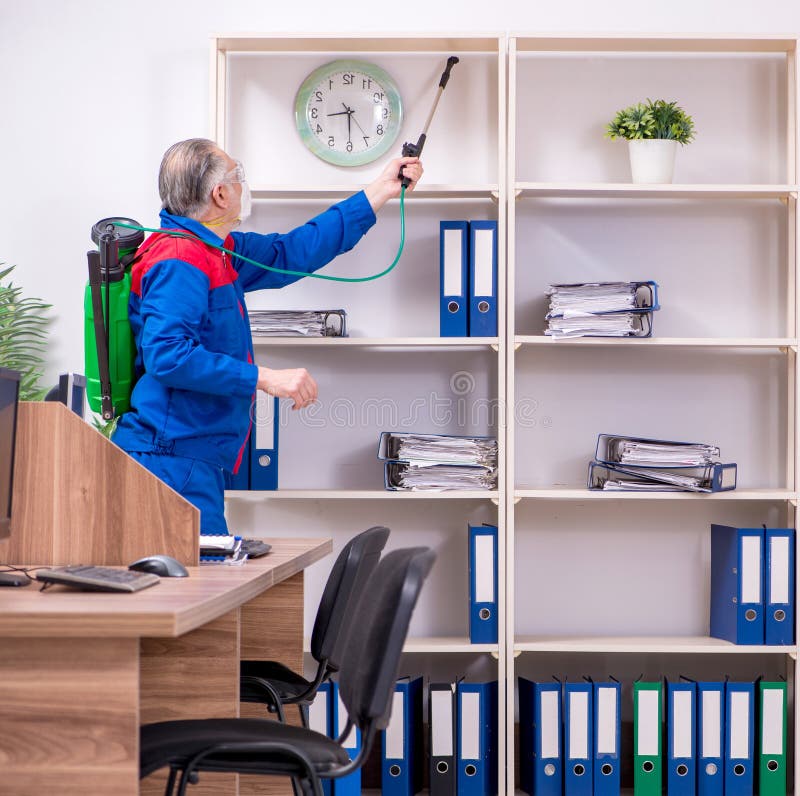 Old Professional Contractor Doing Pest Control in the Office Stock ...