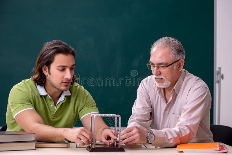 Old Professor Physicist and Young Student in the Classroom Stock Photo ...