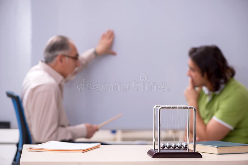 Old Professor Physicist and Young Student in the Classroom Stock Image ...