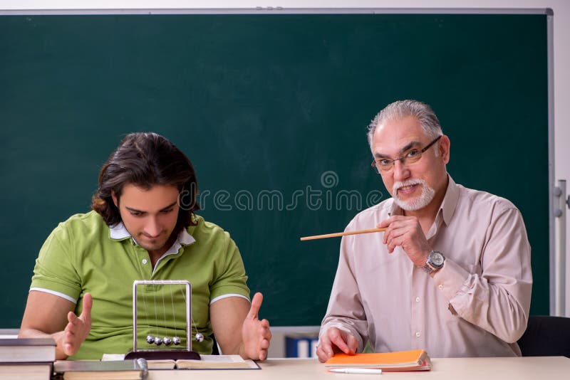 Old Professor Physicist and Young Student in the Classroom Stock Image ...