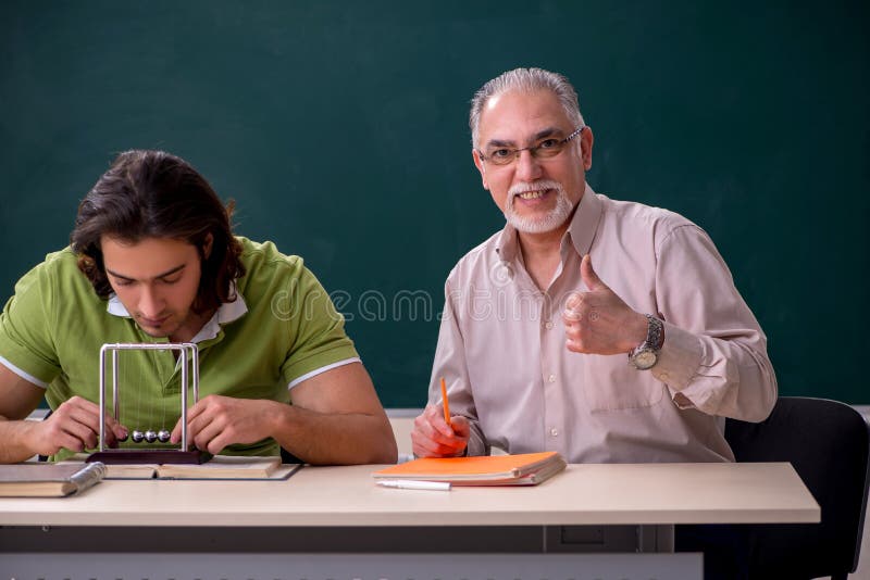 Old Professor Physicist and Young Student in the Classroom Stock Image ...