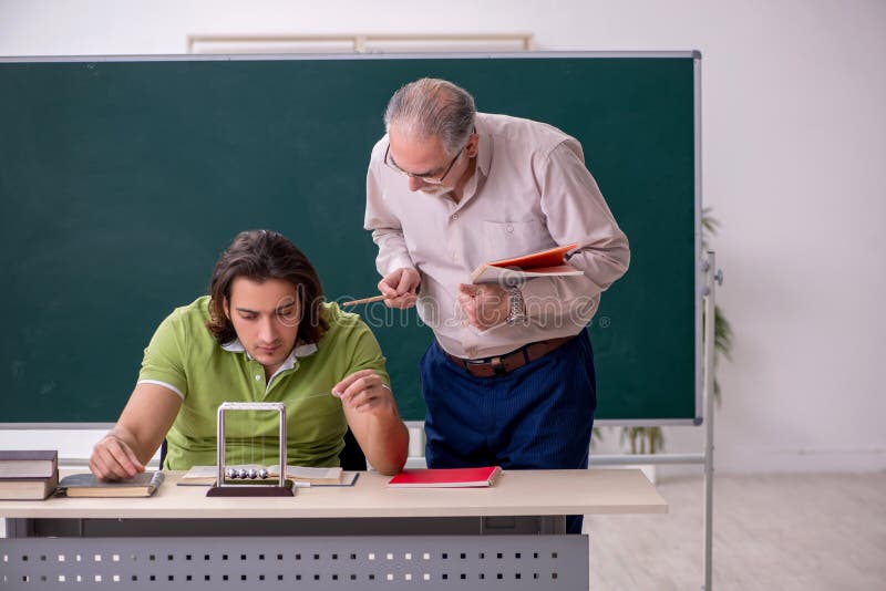 Old Professor Physicist and Young Student in the Classroom Stock Image ...