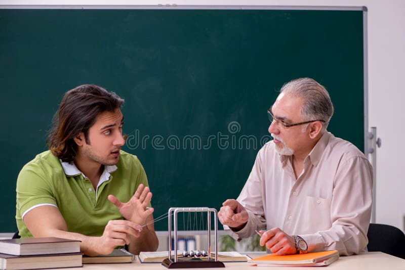 Old Professor Physicist and Young Student in the Classroom Stock Photo ...