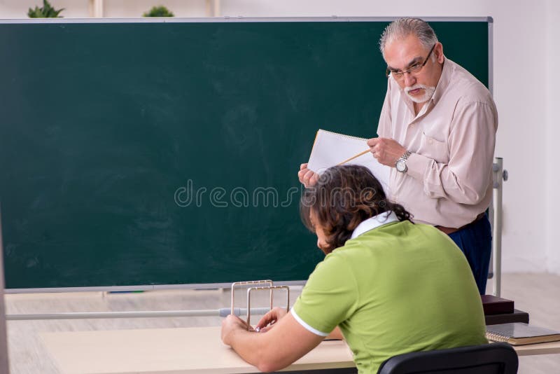 Old Professor Physicist and Young Student in the Classroom Stock Image ...