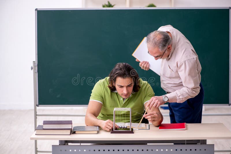 Old Professor Physicist and Young Student in the Classroom Stock Photo ...