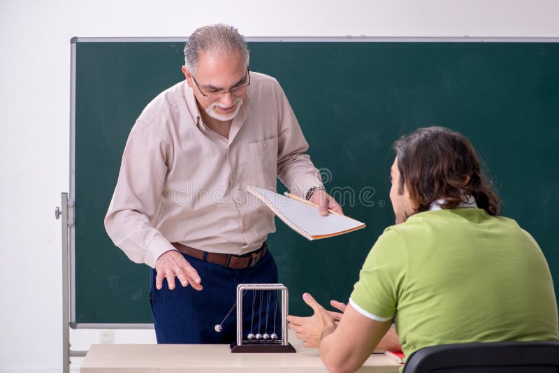 Old Professor Physicist and Young Student in the Classroom Stock Image ...
