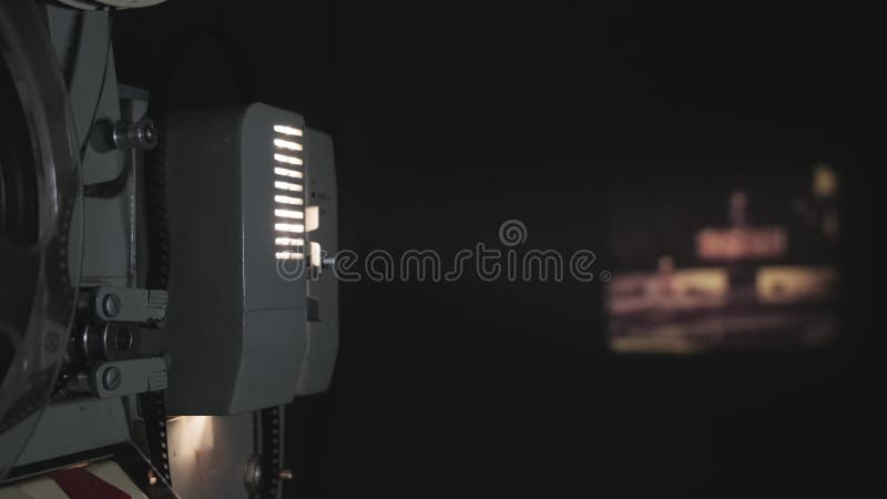 Old projector showing film stock footage. Video of running - 346763994
