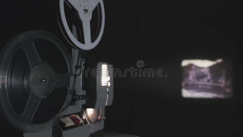 Old projector showing film stock video. Video of frame - 346771335