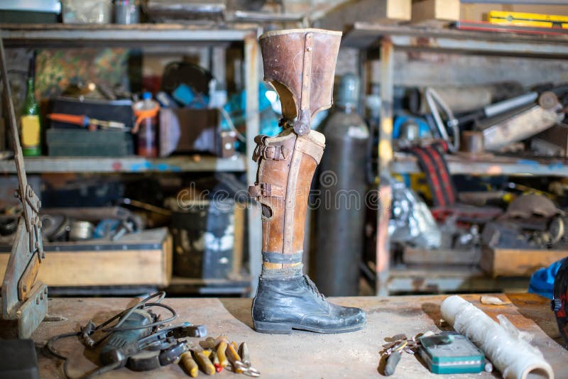 Old Prosthetic Leg Displayed on Workshop Table Stock Photo - Image of ...