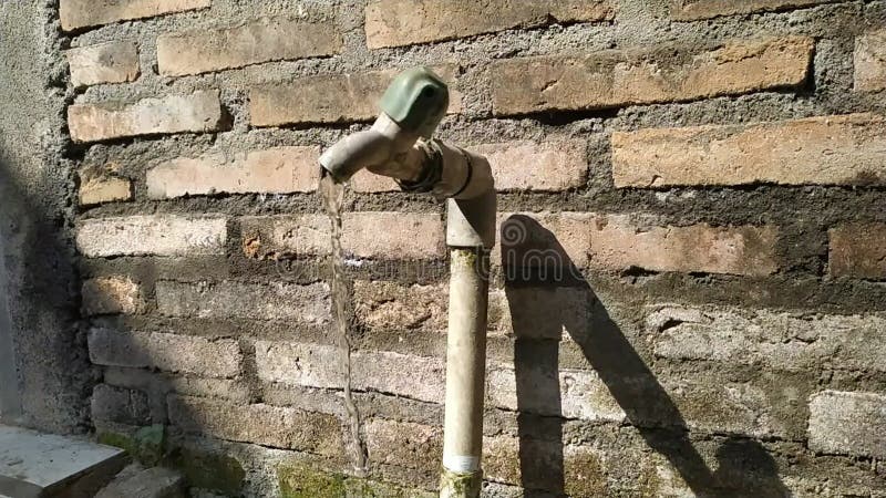 Old PVC Pipe Water Tap with Broken Handle and Flowing Water Stock ...