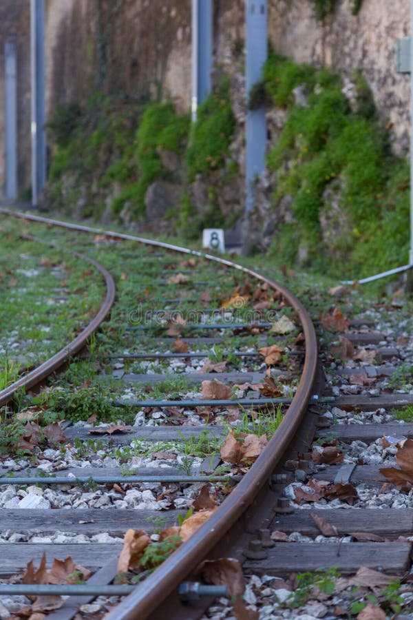 Old Rails for Train a Near of Stone Wall Stock Image - Image of rock ...