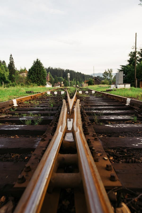 Old Railway Track on the Background of the Station in the Mountains ...